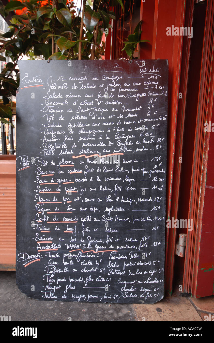 PARIS, FRANCE. A chalkboard menu outside a restaurant on Boulevard ...