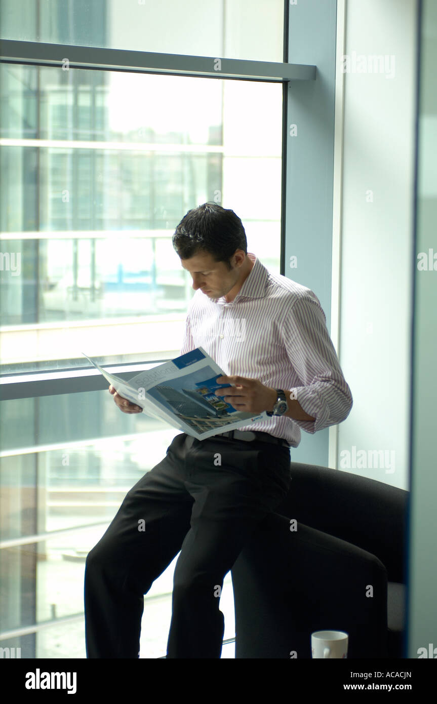 Man reading magazine uk hi-res stock photography and images - Alamy