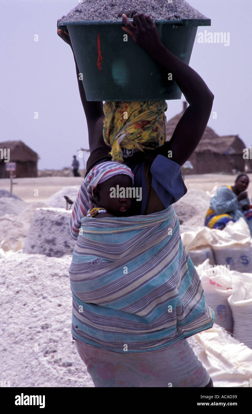 Women salt mining workers carrying their child in Senegal Stock Photo ...