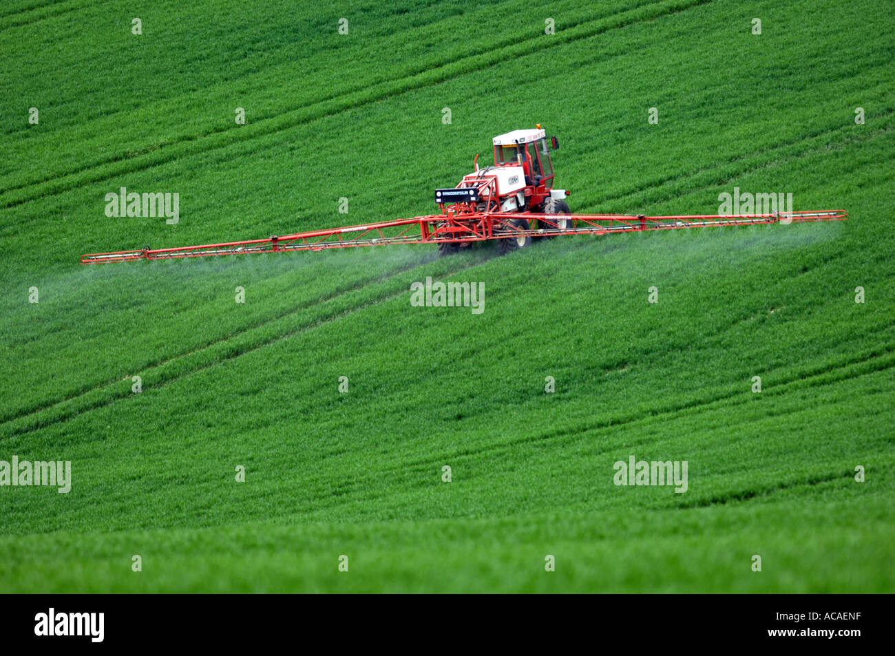 Crop spraying crops spray farm farming tractor, Britain UK Stock Photo ...
