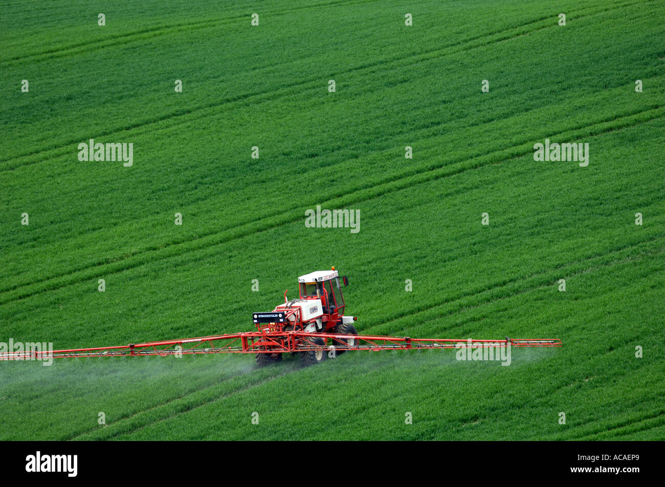 Crop spraying crops spray farm farming tractor, Britain UK Stock Photo ...