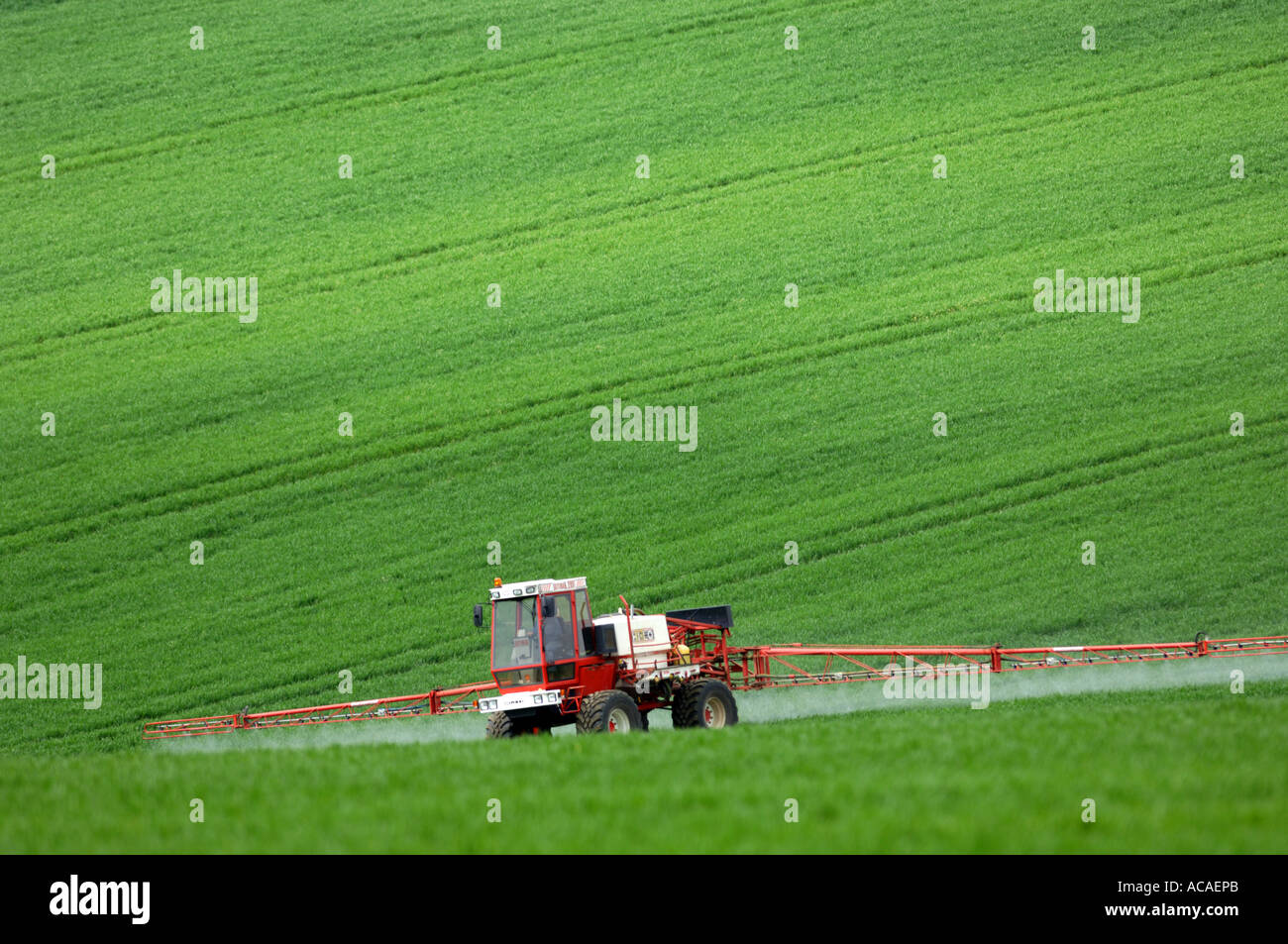 Crop spraying crops spray farm farming tractor, Britain UK Stock Photo ...