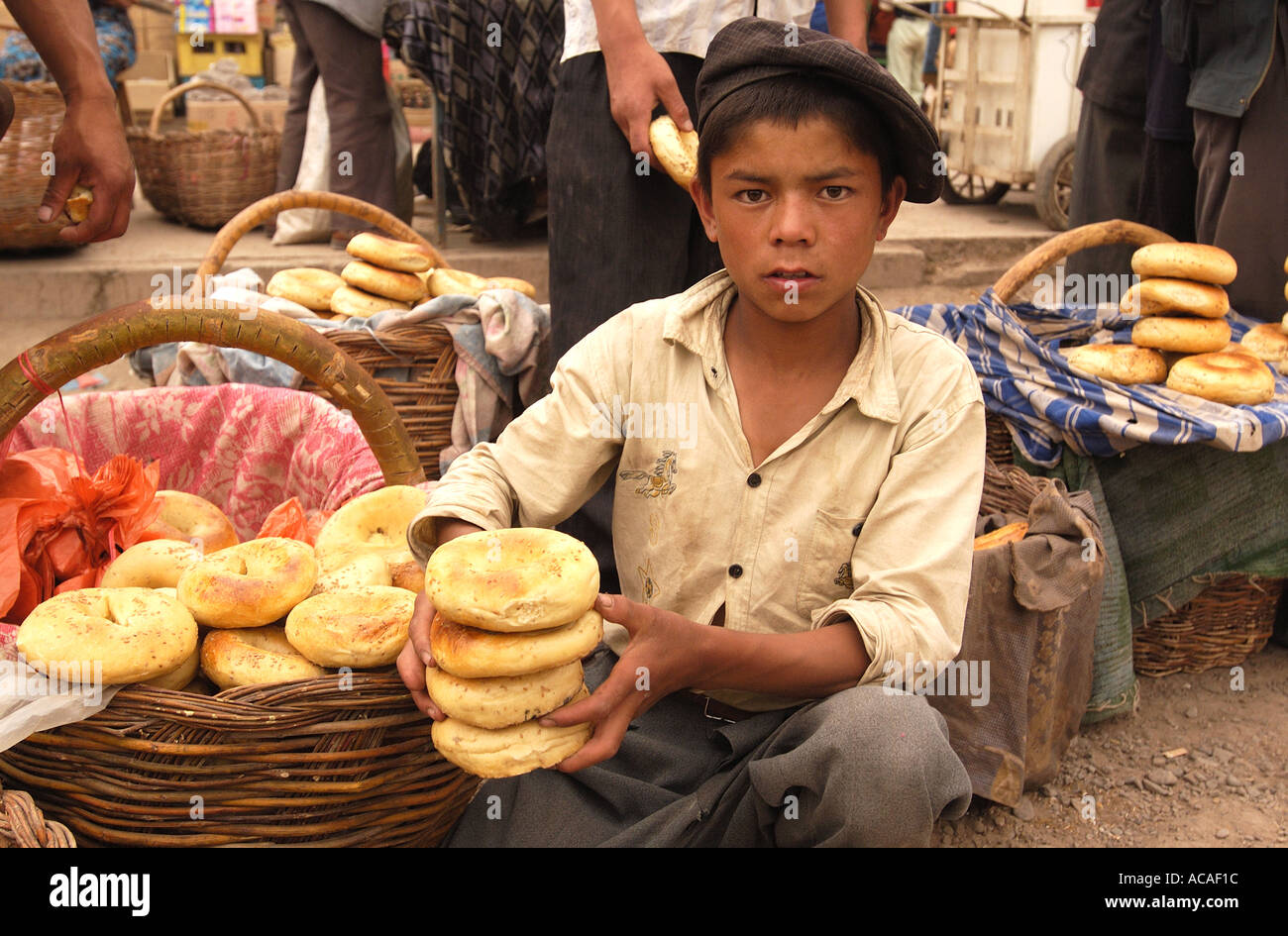 A Uigur boy selling bread in Kashgar Xinjiang China on the Silk Road ...