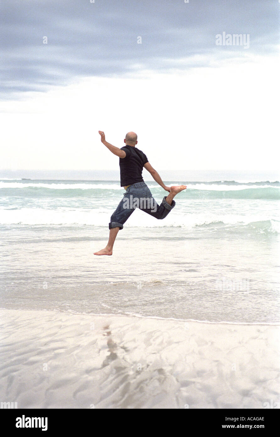 man jumping on the beach Stock Photo - Alamy
