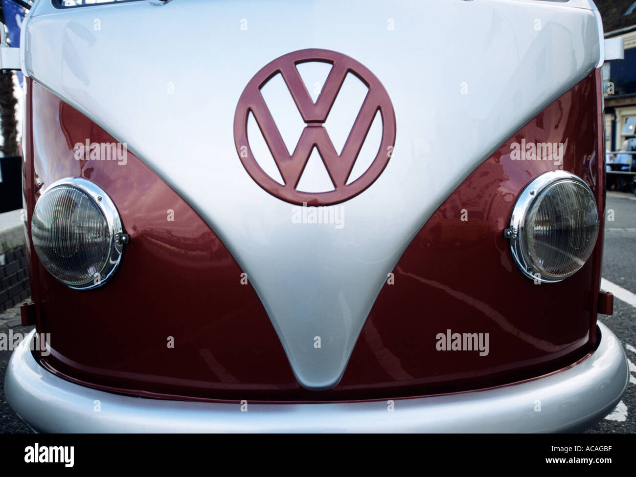A front view of an early metallic red and silver VW camper van Stock ...