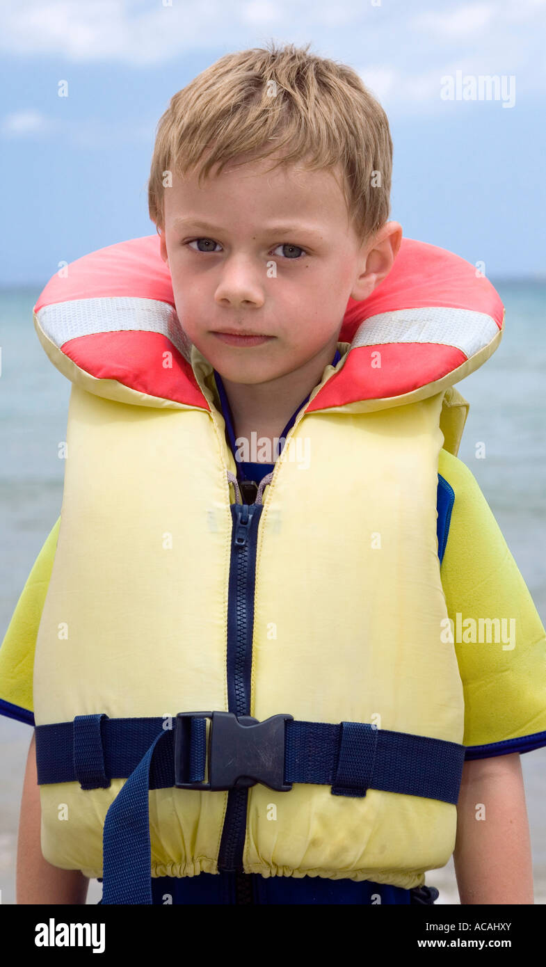 A boy, 5 years old, with a yellow life jacket Stock Photo - Alamy