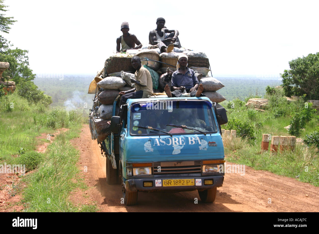 Overloaded truck coming from Market in Ghana West Africa Stock Photo ...