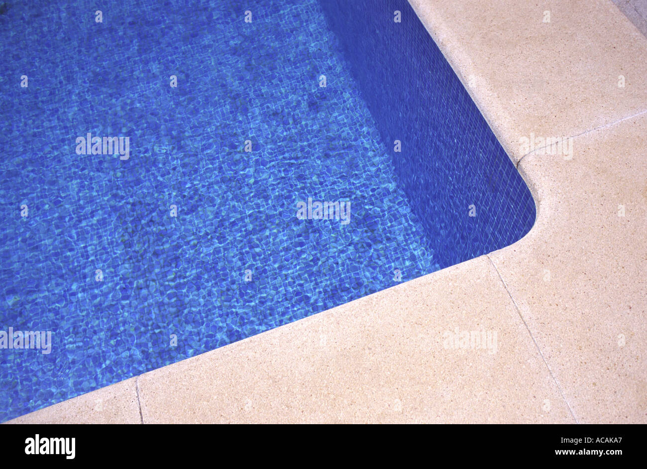 Corner of swimming pool in the sunshine Stock Photo - Alamy