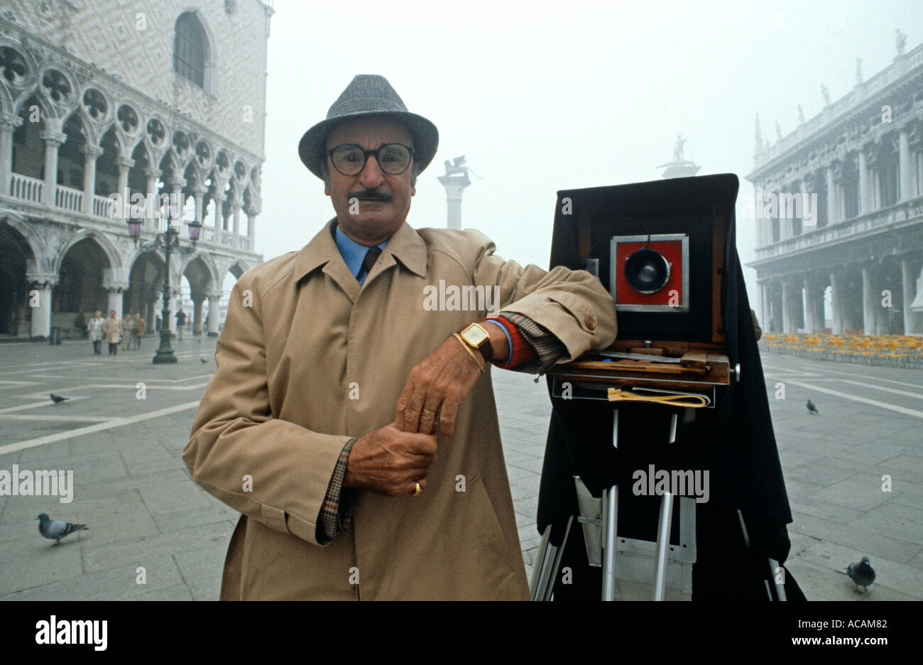 Street photographer retro vintage 1980s in Venice with old style camera ...