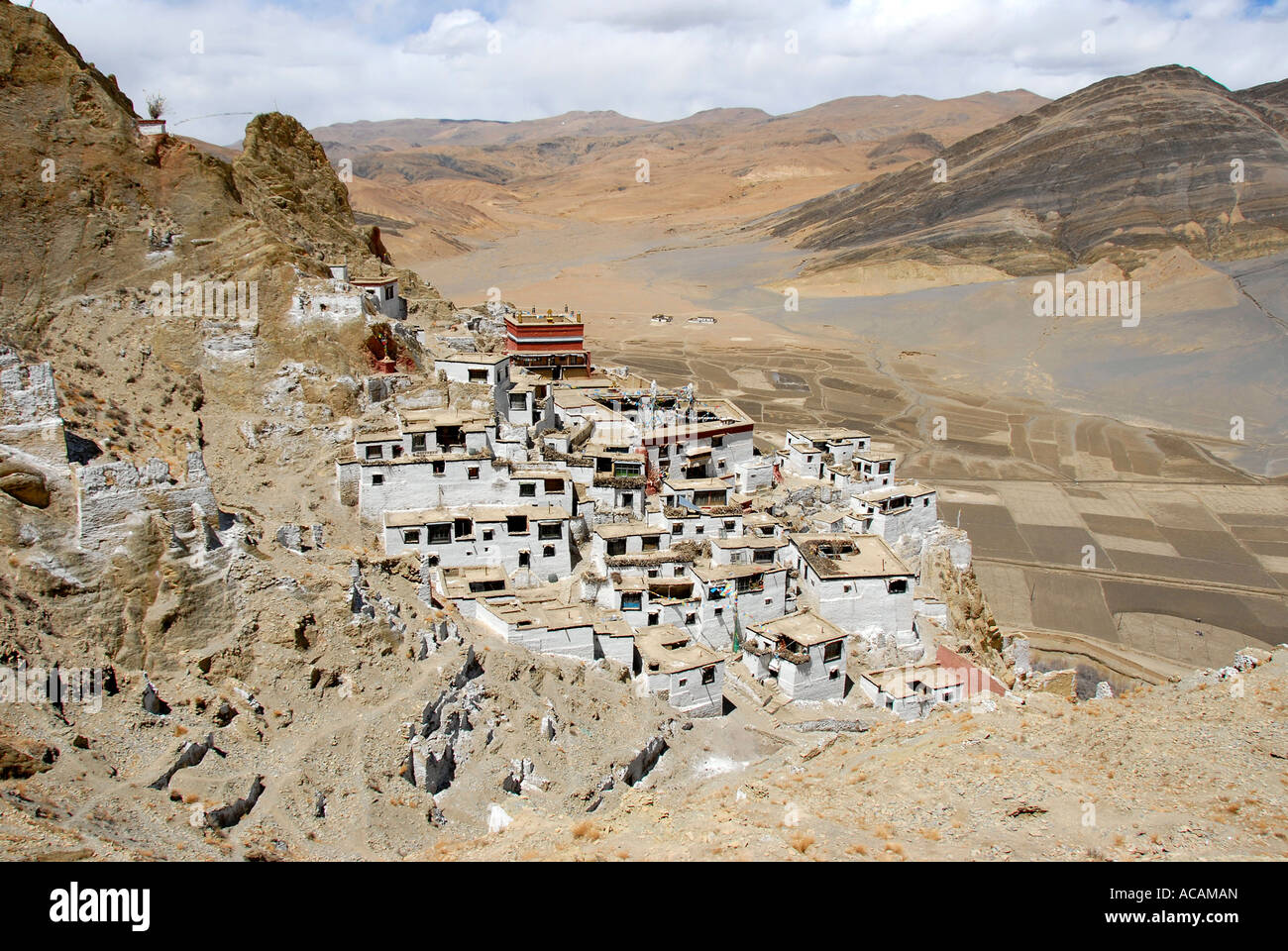 Mountain and monastery Shegar with white washed walls situated at the ...