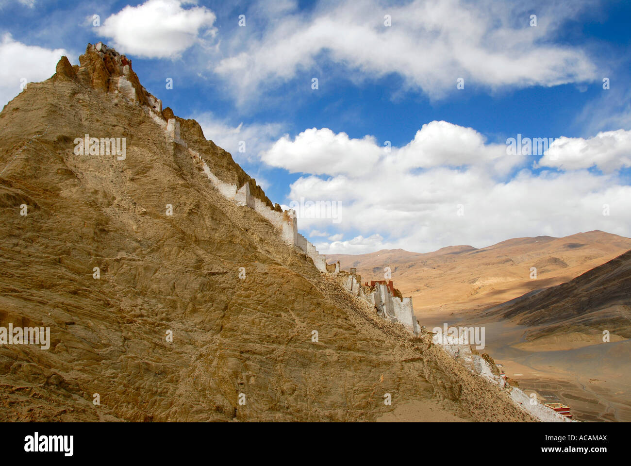 Old fortress dzong on the mountain top with steep wall Shegar Tibet ...