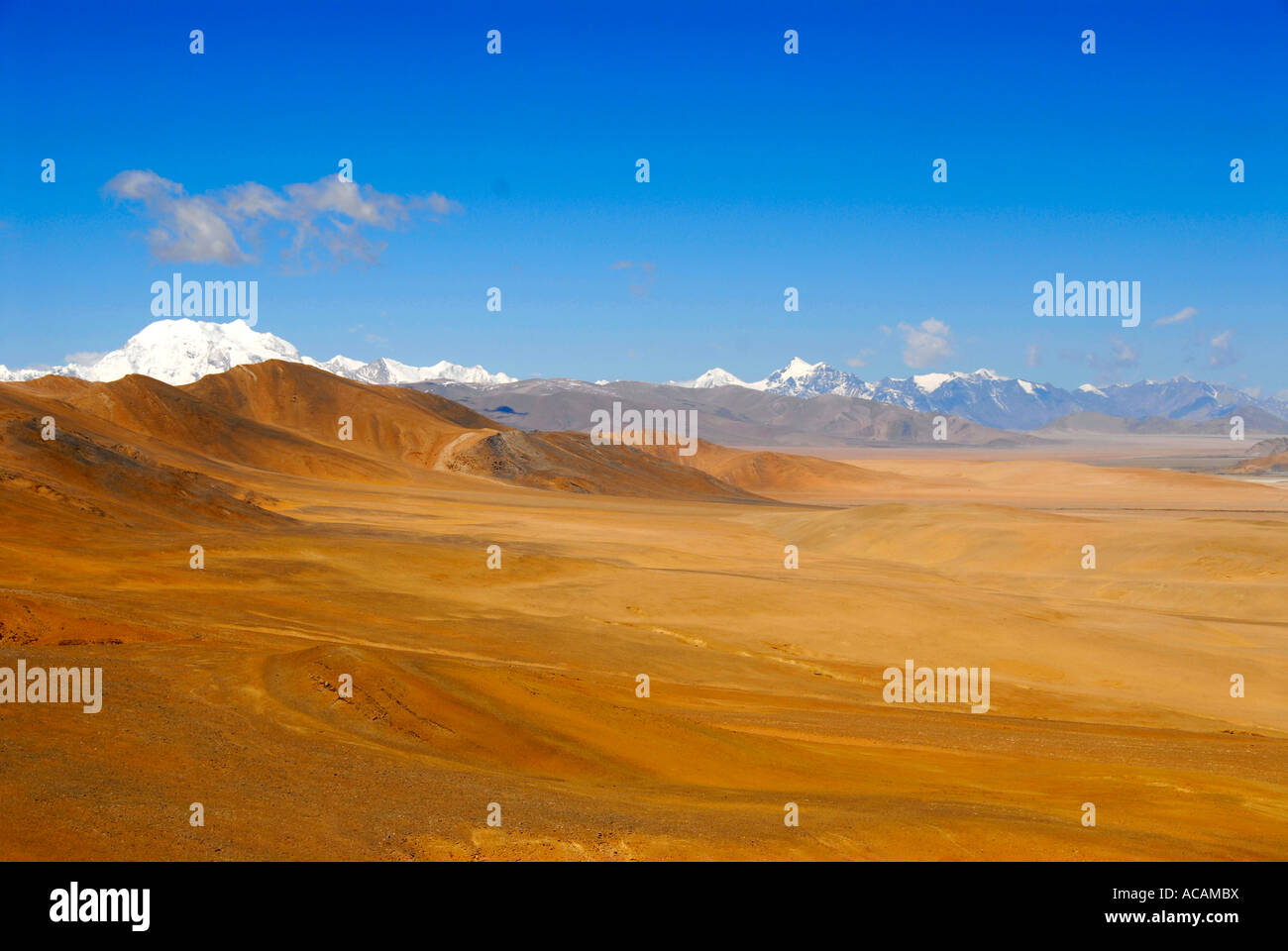 Barren wide open high plain with ice-capped peak Shisha Pangma (8013 m ...