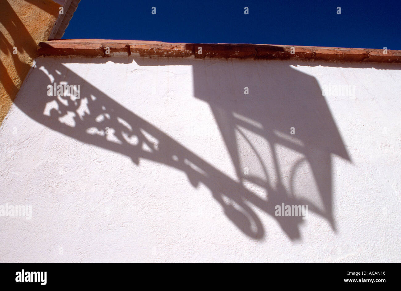 Spanish conceptual holiday Traditional sun with shadow cast on ...