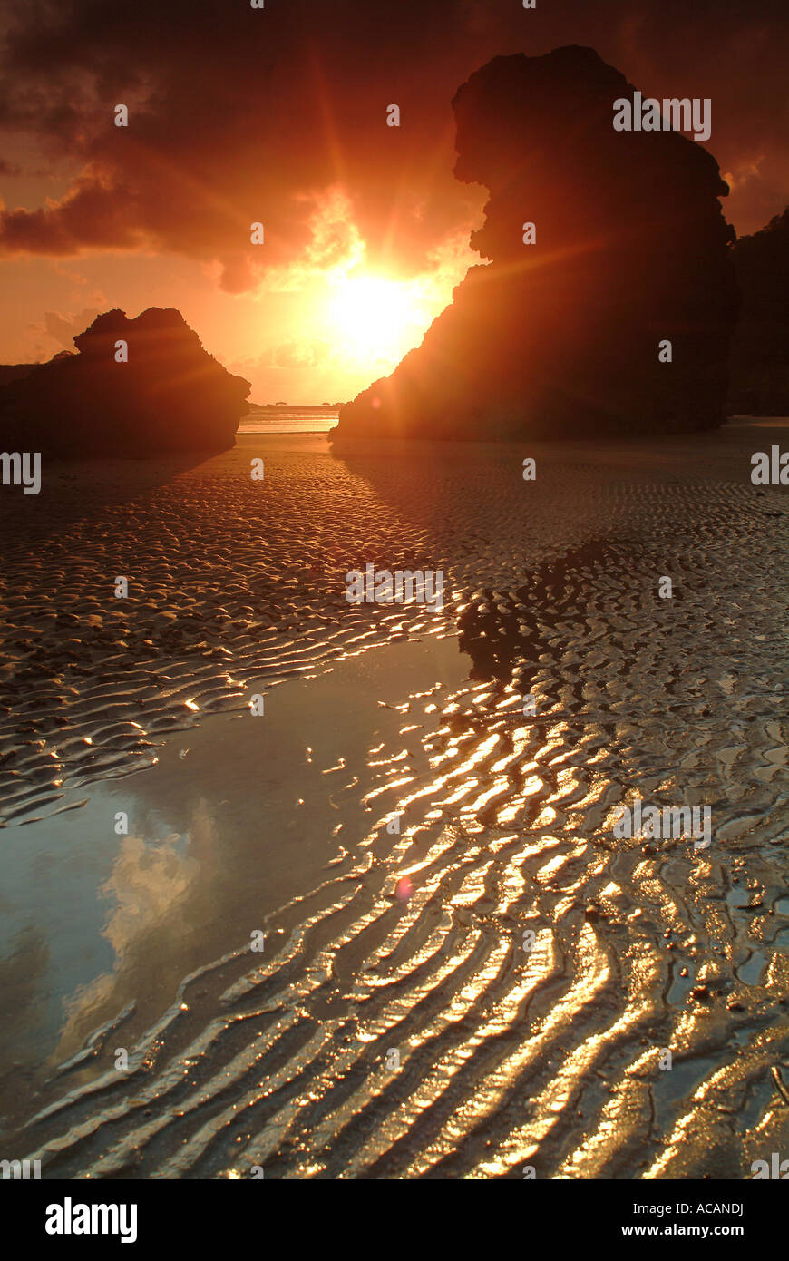 Rock formation on the beach at sunset, Hinchinbrook Island, Queensland ...