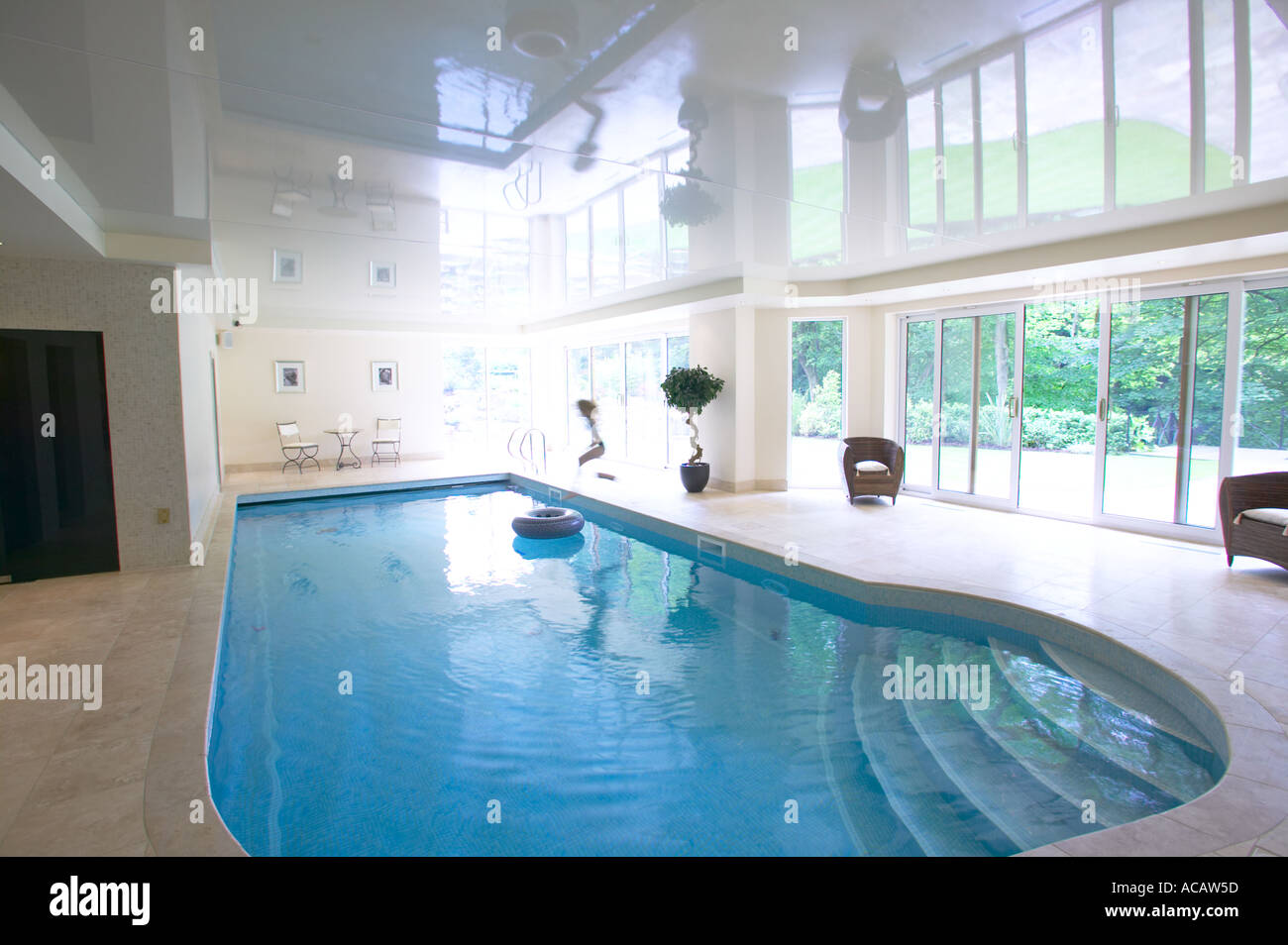 Large swimming pool in detached home Stock Photo - Alamy