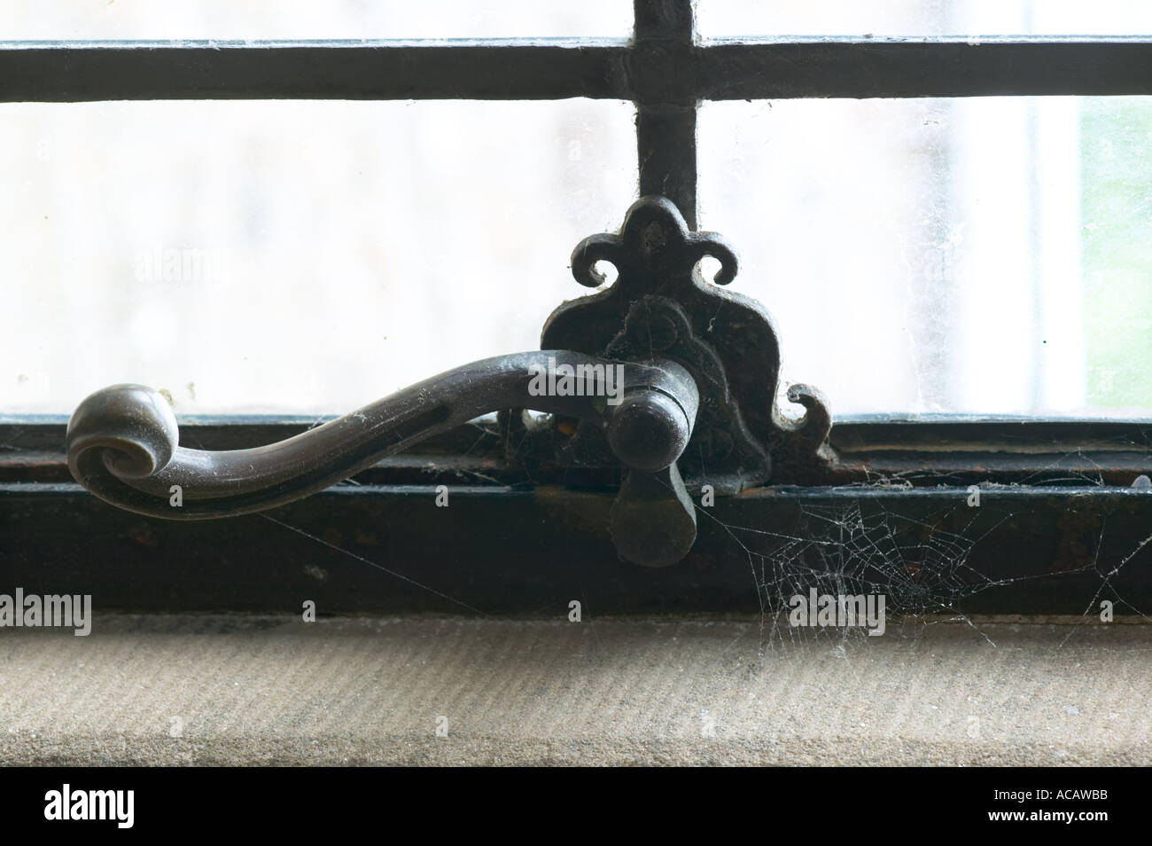 Old metal window catch Stock Photo - Alamy