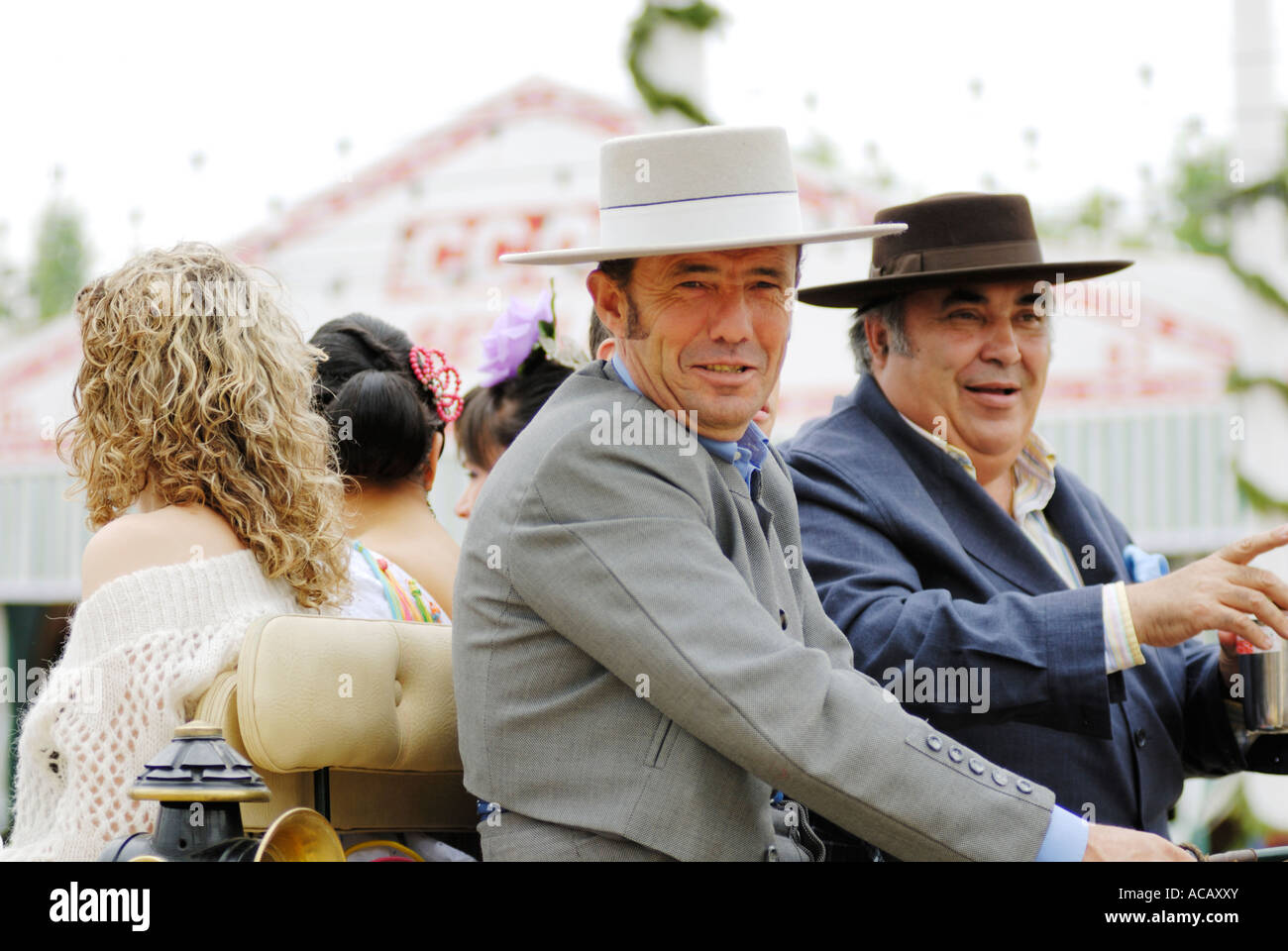 Spain, Seville, Men in hat riding carriage Stock Photo - Alamy