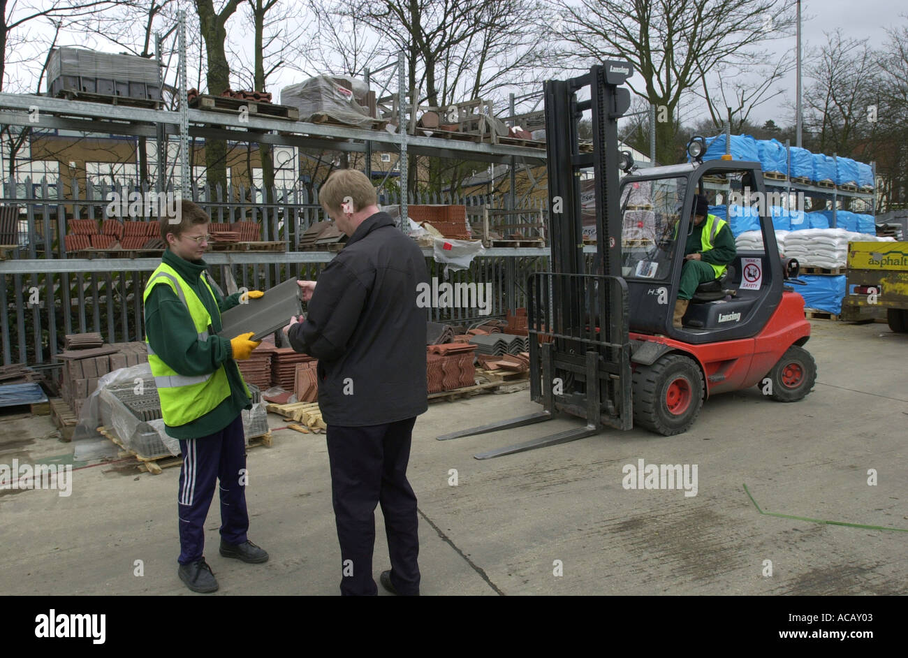 Customer is helped in a builders yard UK Stock Photo - Alamy