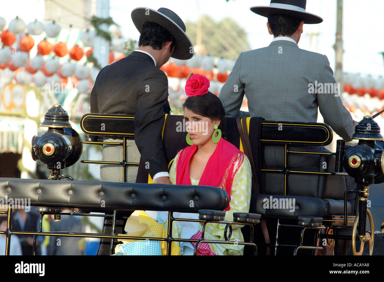 Two coachmen in traditional uniform drive their carriage through the ...