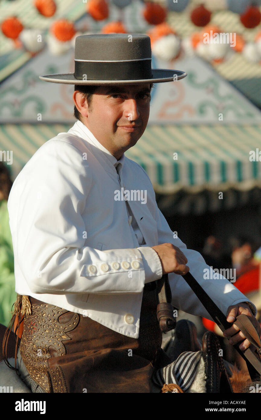 Portrait of a horseman in traditional dress riding at the April Fair ...