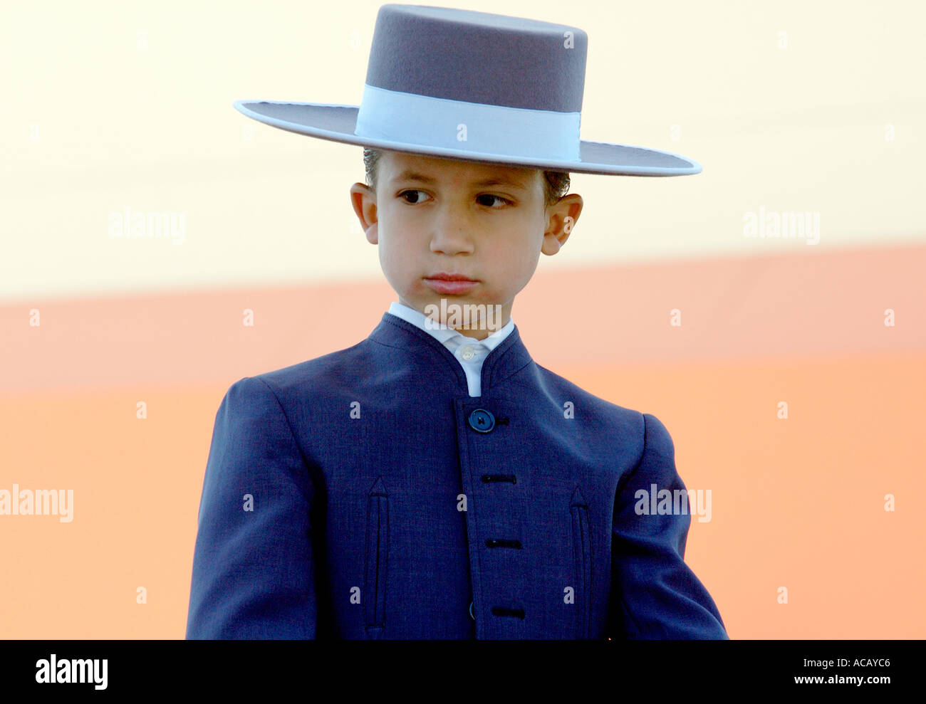 Young boy in traditional costume riding at the April Fair Seville ...