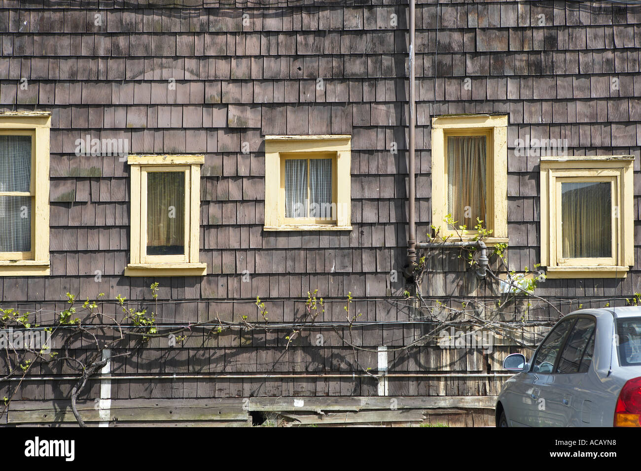 Exterior of apartment building with assorted random sized windows ...