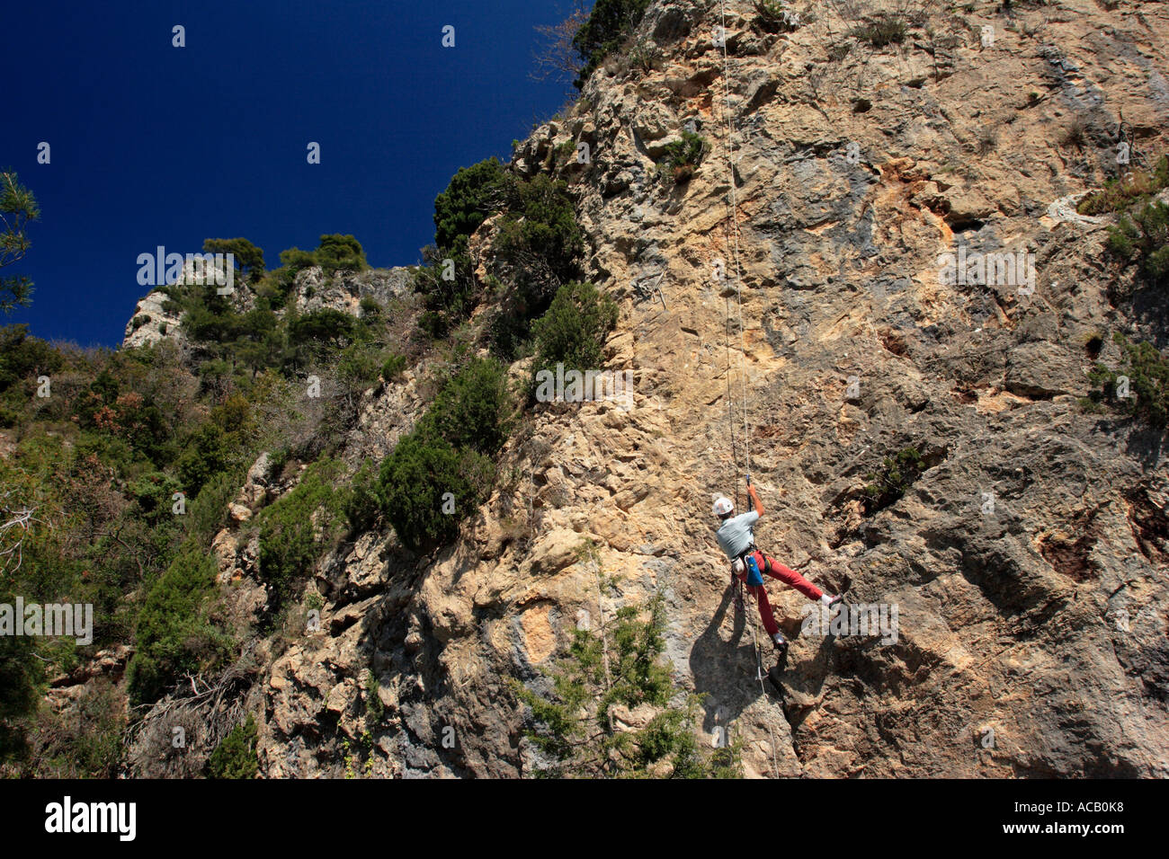 Man climbing in the Baou de St Jeannet near Nice Workman changing old ...