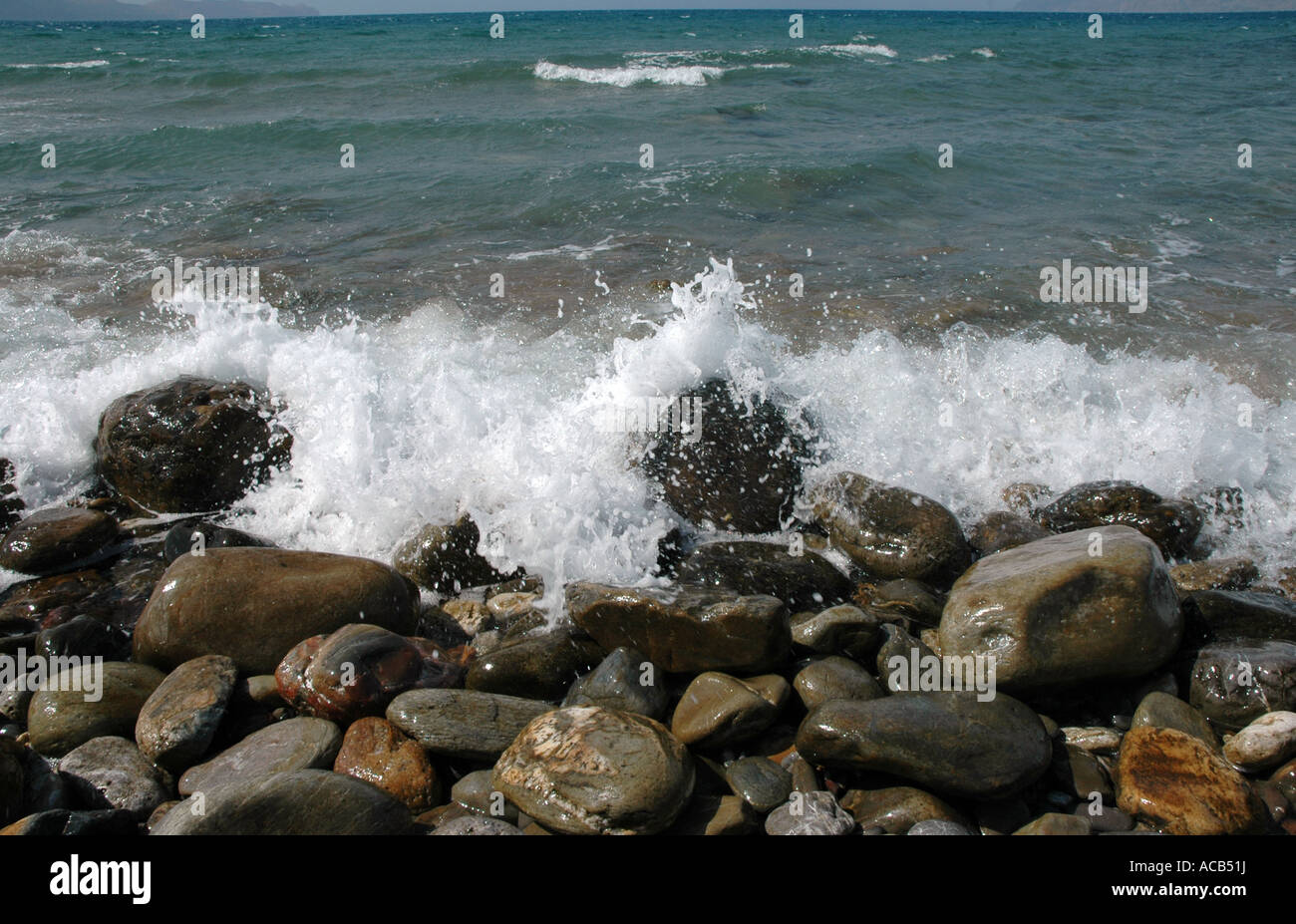 Stony beach over Mediterranean Sea in Kissamos town on island of Crete ...