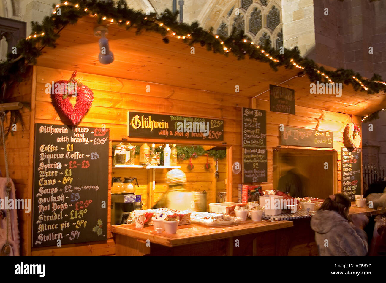 Refreshment stall at Christmas market around Bath Abbey BATH England UK ...