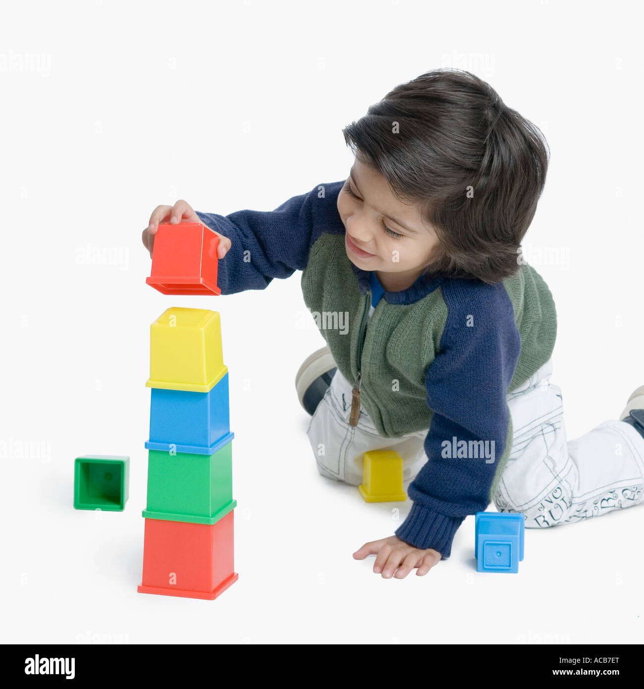 Boy playing with plastic blocks Stock Photo - Alamy