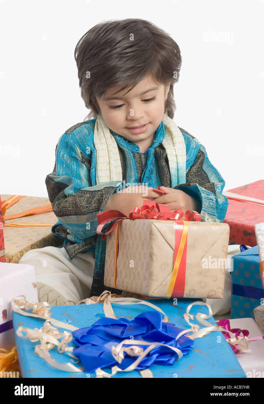 Boy opening present indian High Resolution Stock Photography and Images ...