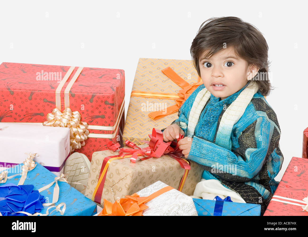 Boy opening present indian hi-res stock photography and images - Alamy
