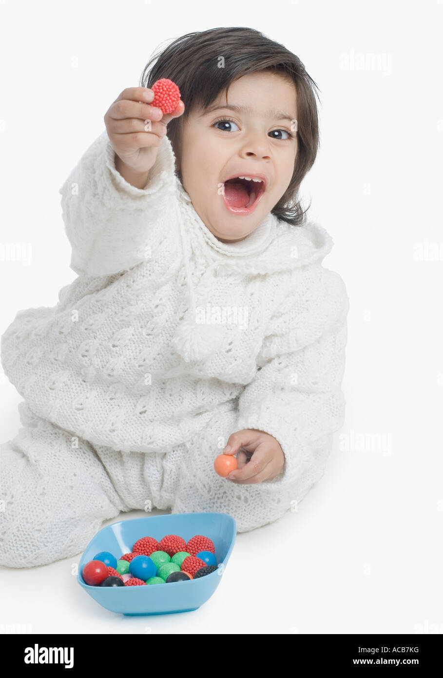 Portrait of a boy showing a plastic ball Stock Photo - Alamy