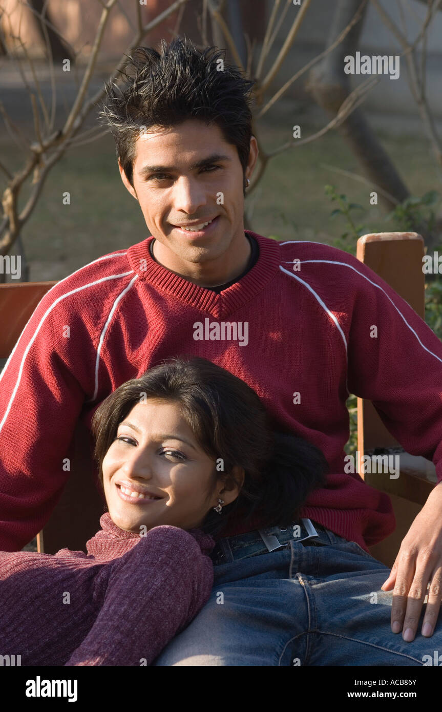 Young woman sitting on mans lap hi-res stock photography and images - Alamy