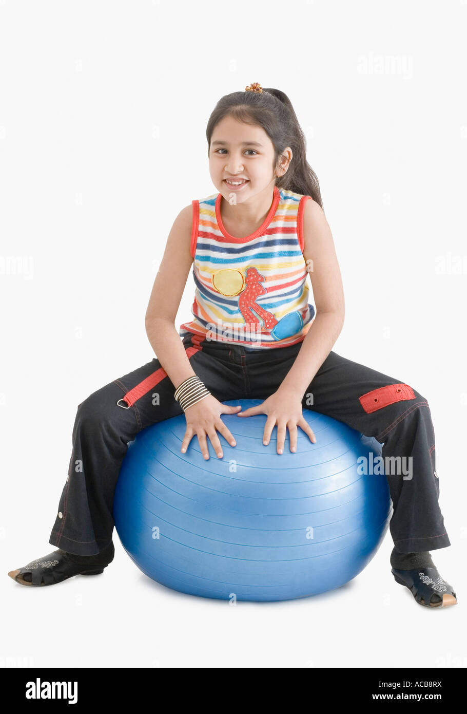 Portrait of a girl sitting on a fitness ball Stock Photo - Alamy