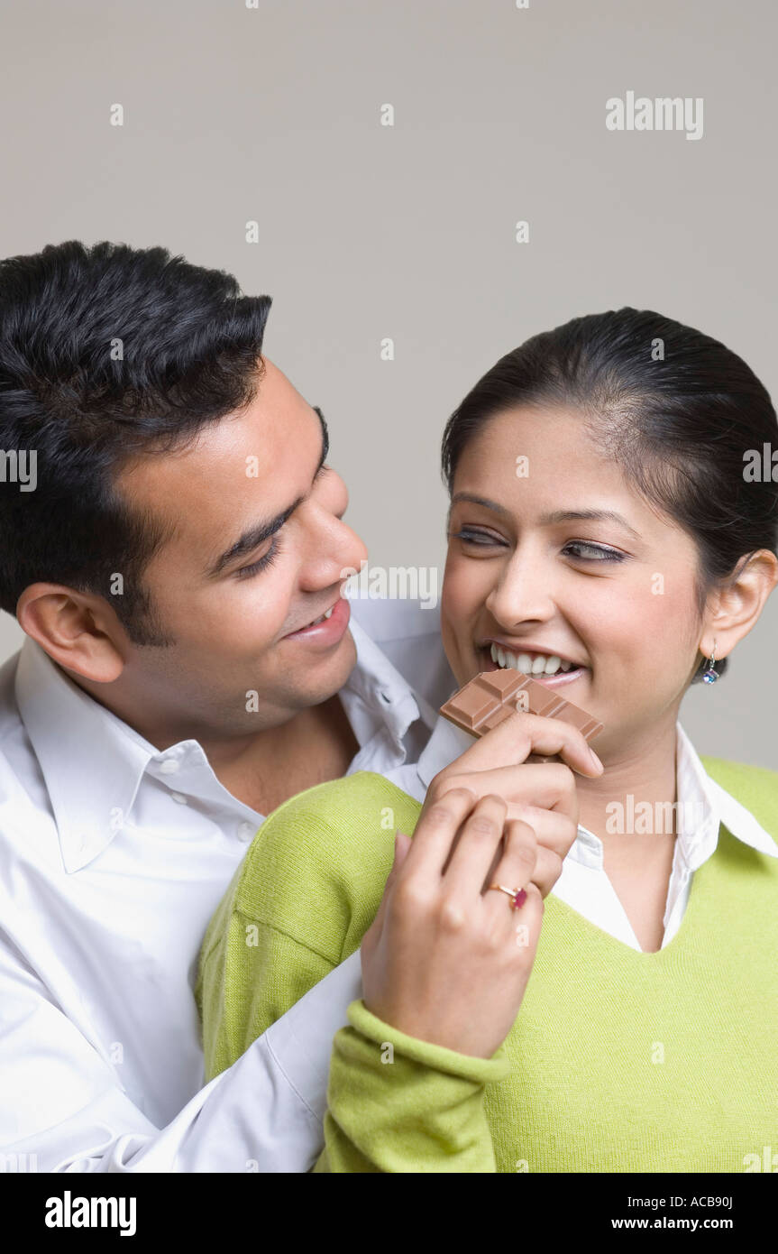 Couple feeding each other chocolate hi-res stock photography and images ...