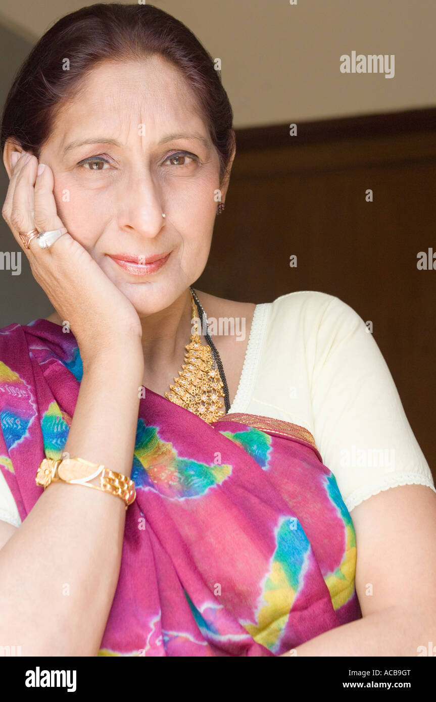 Portrait of a mature woman contemplating Stock Photo - Alamy