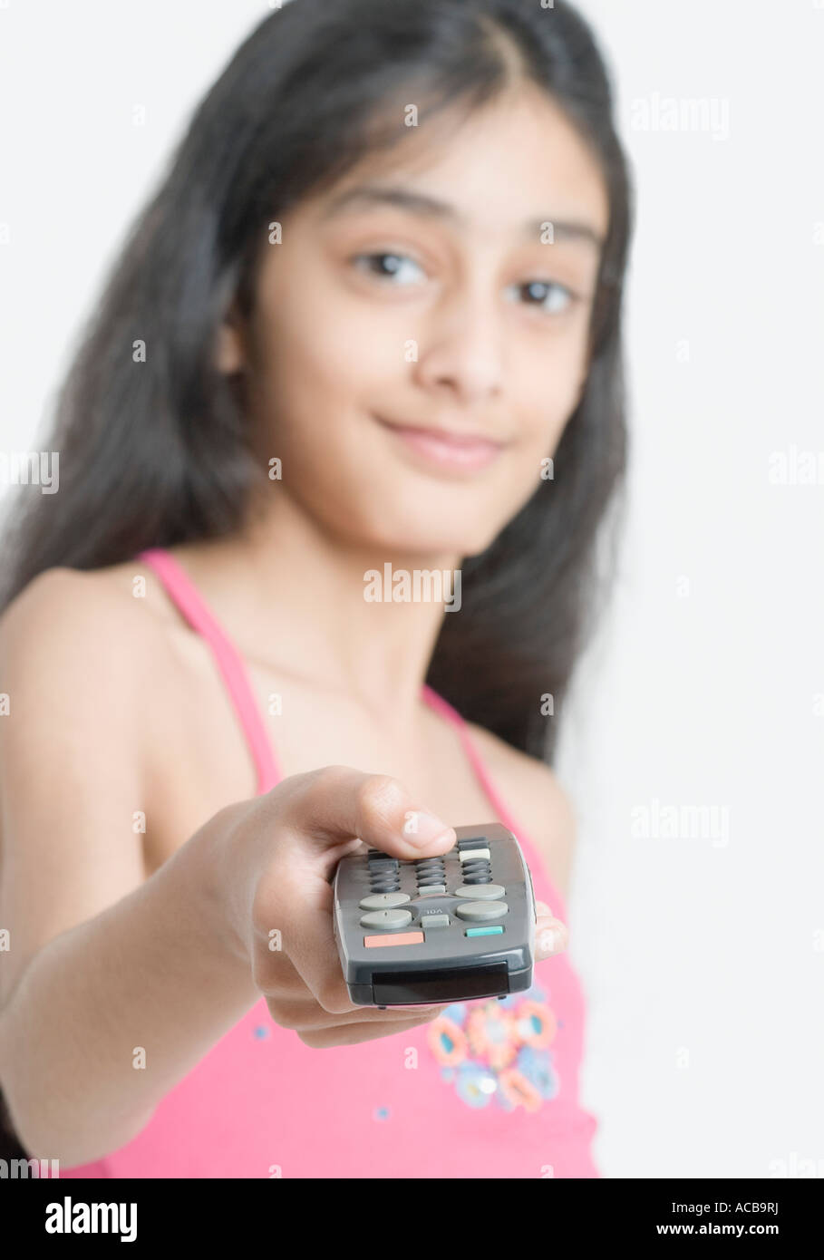 Girl holding a tv remote hi-res stock photography and images - Alamy