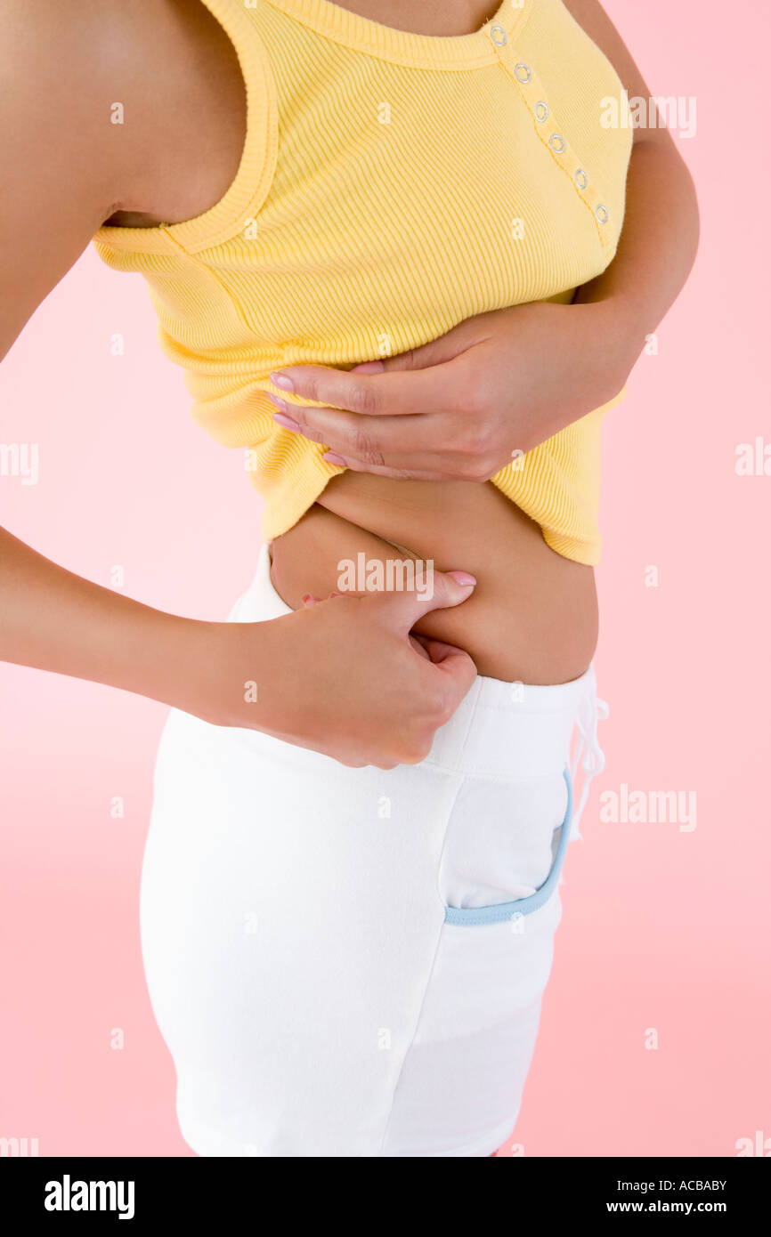 Woman pinching fat hi-res stock photography and images - Alamy