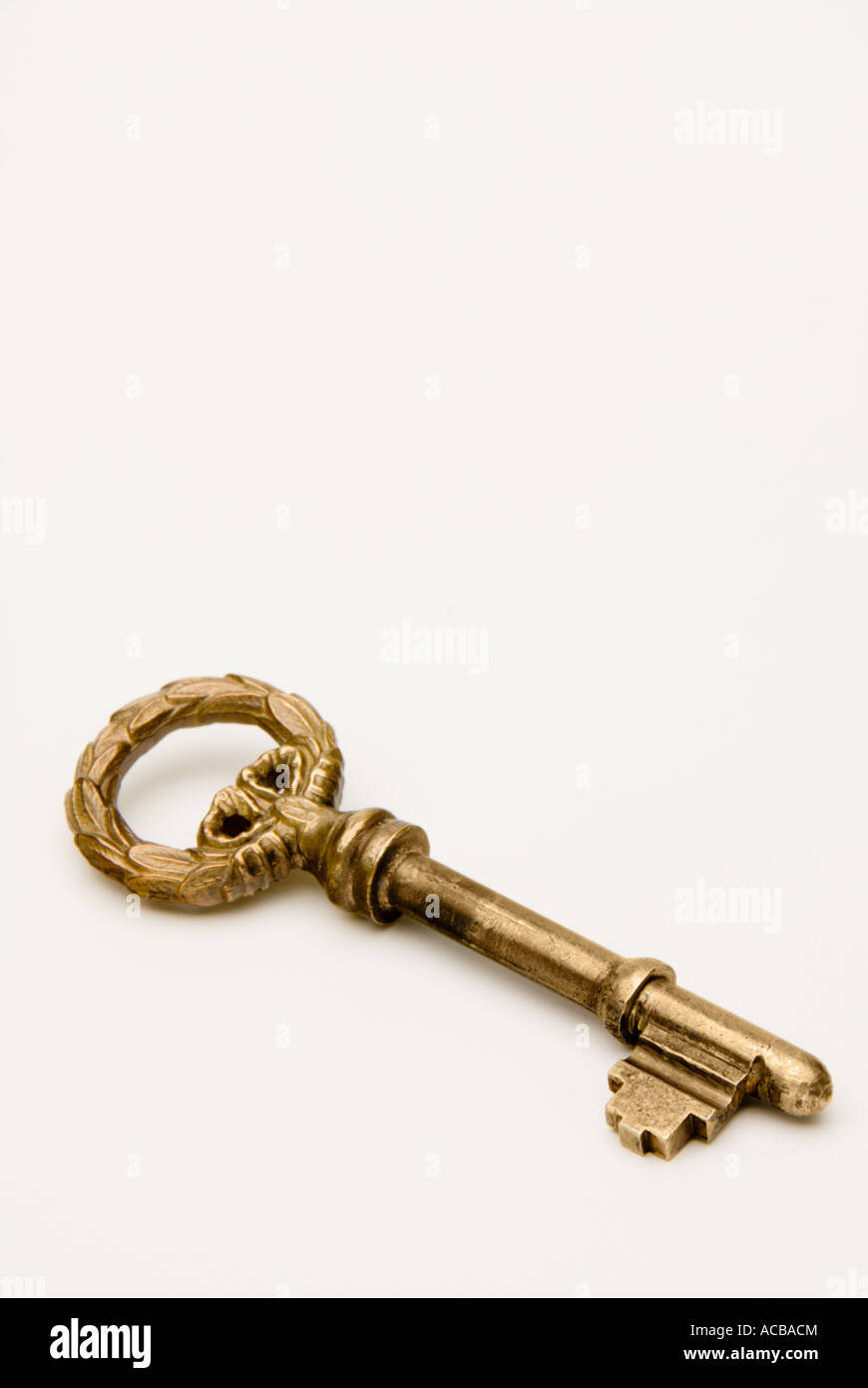 Single Old gold door key, concept Stock Photo - Alamy