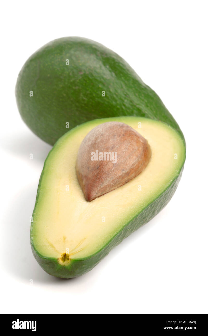 Two Avocados one halved Stock Photo - Alamy