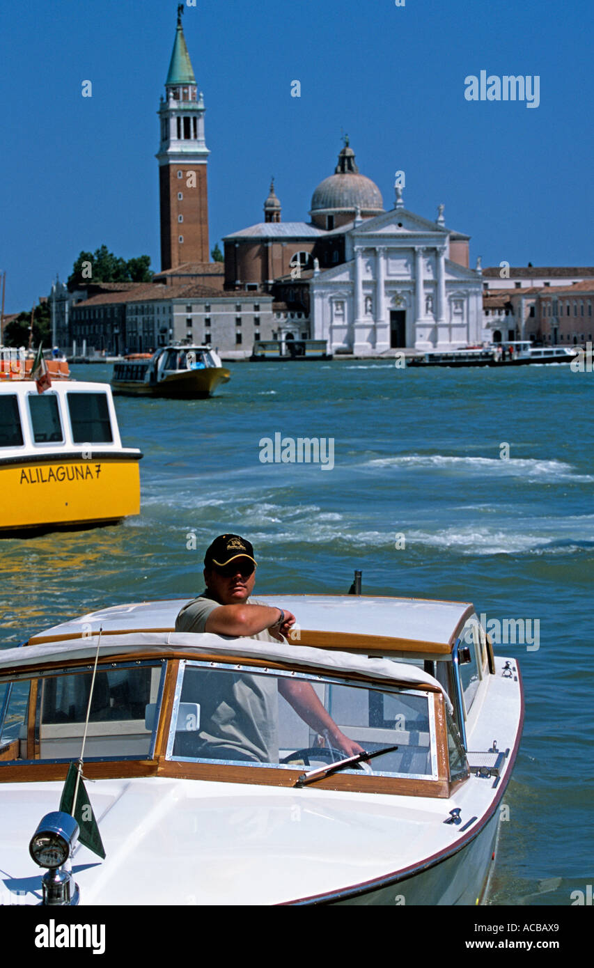 Motorboats, Il Redentore on Giudecca and St Marks' Campanile in ...