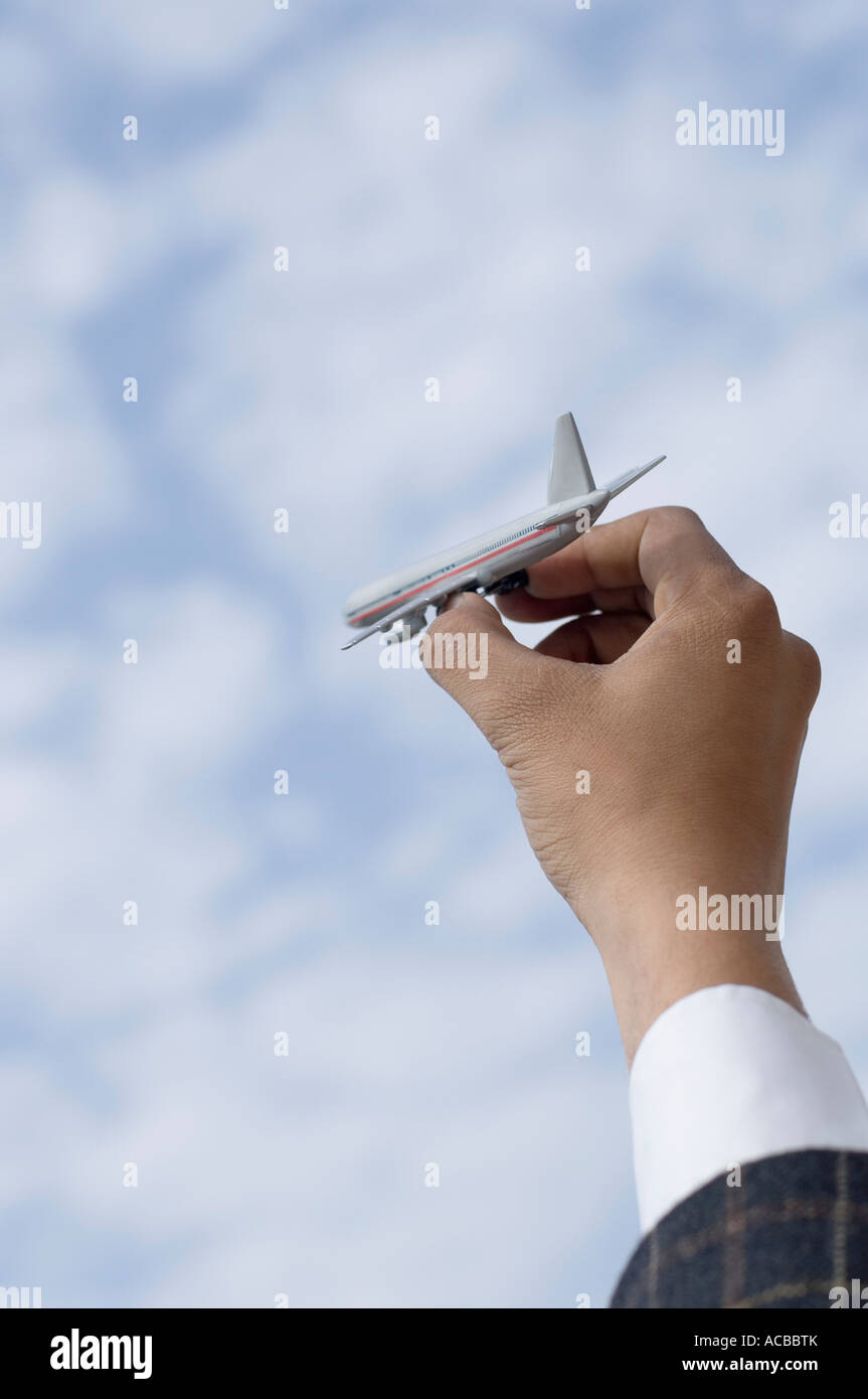 Close-up of a person's hand holding a model airplane Stock Photo - Alamy