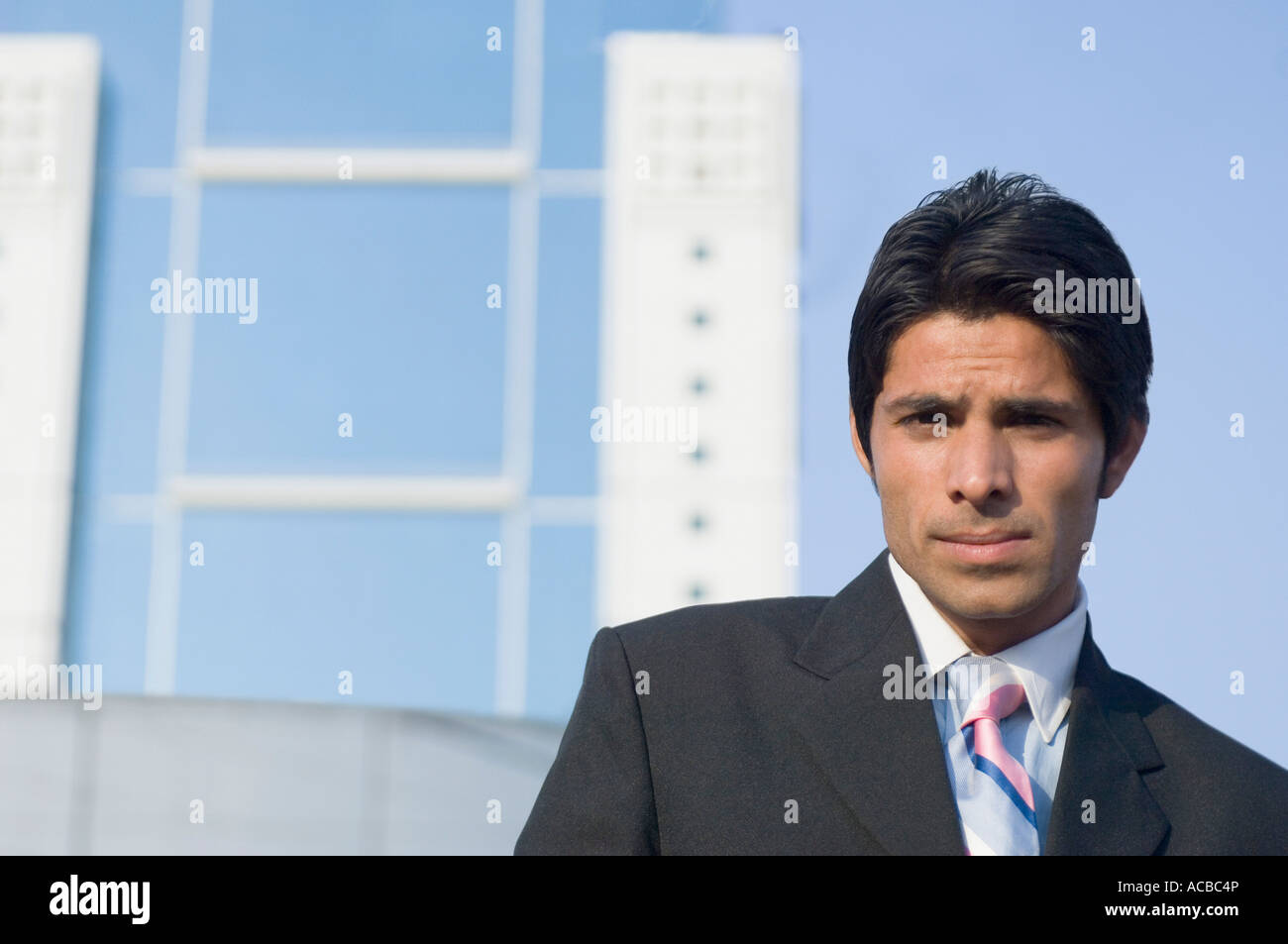 Portrait of a businessman thinking Stock Photo - Alamy