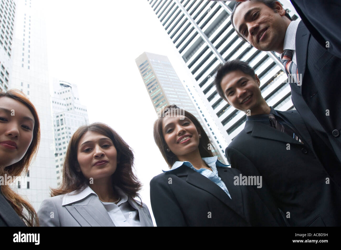 Low angle view of five business executives standing together Stock ...