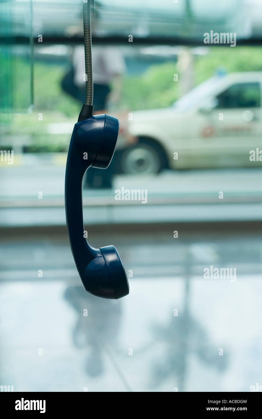 Close-up of a telephone receiver hanging Stock Photo - Alamy