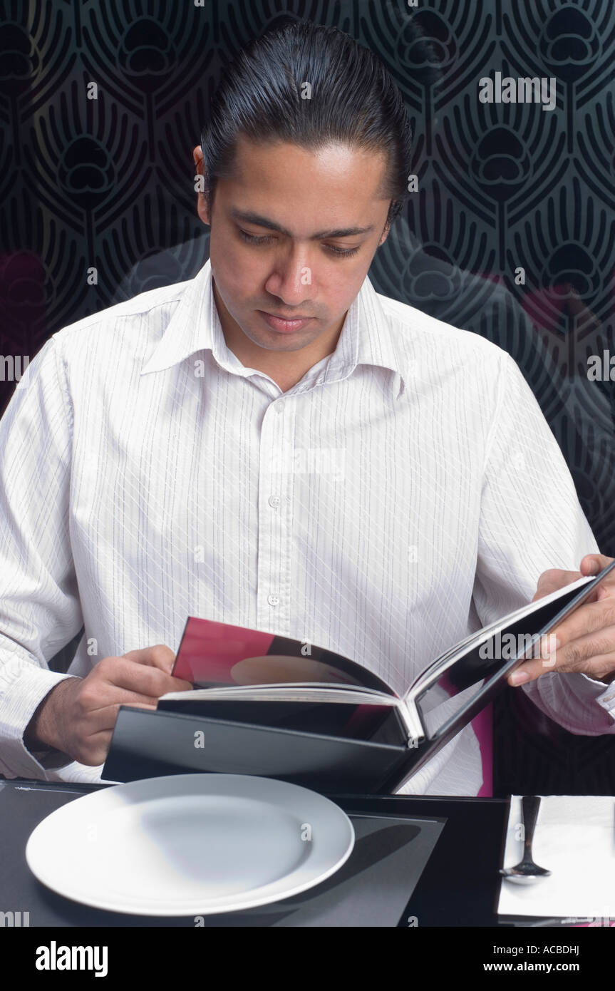 Man looking menu in fine hi-res stock photography and images - Alamy