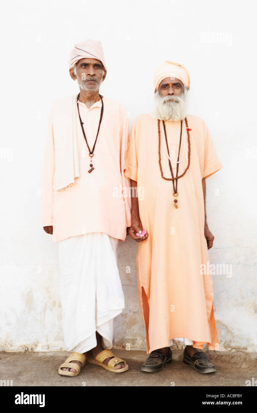 Two sadhus standing together Stock Photo - Alamy