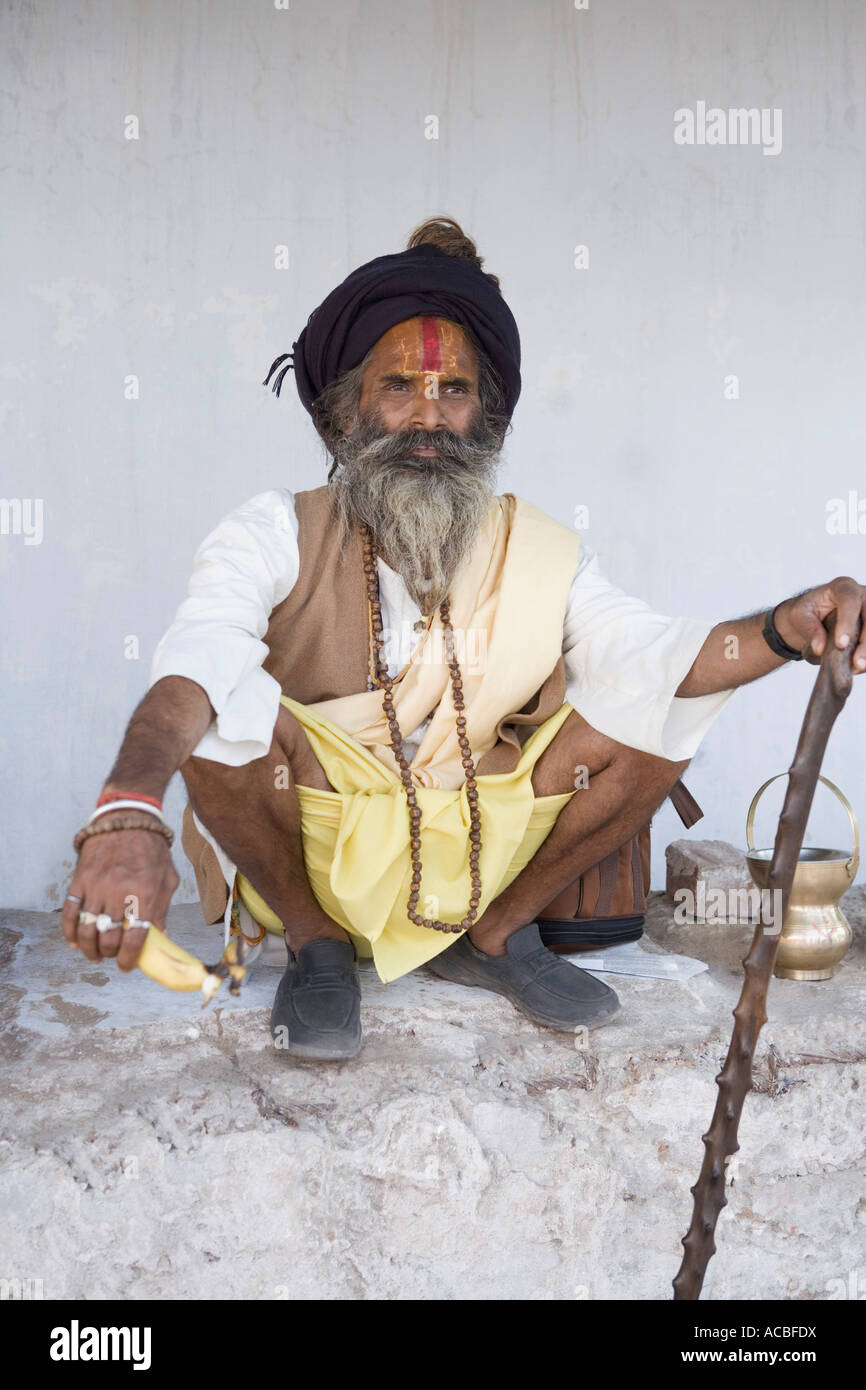 Indian man crouching on wall hi-res stock photography and images - Alamy