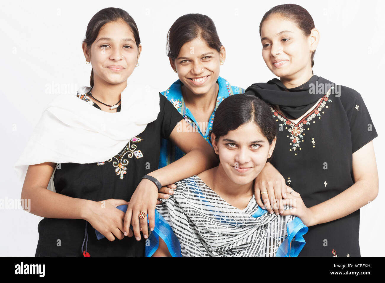 Close-up of four girls smiling together Stock Photo - Alamy
